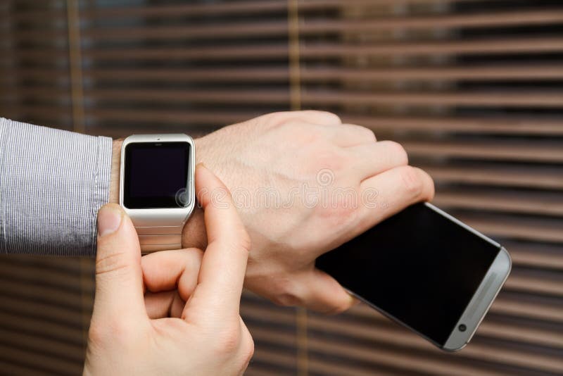 Phone and Smart Watch on a Male Hand Stock Photo - Image of gadget ...