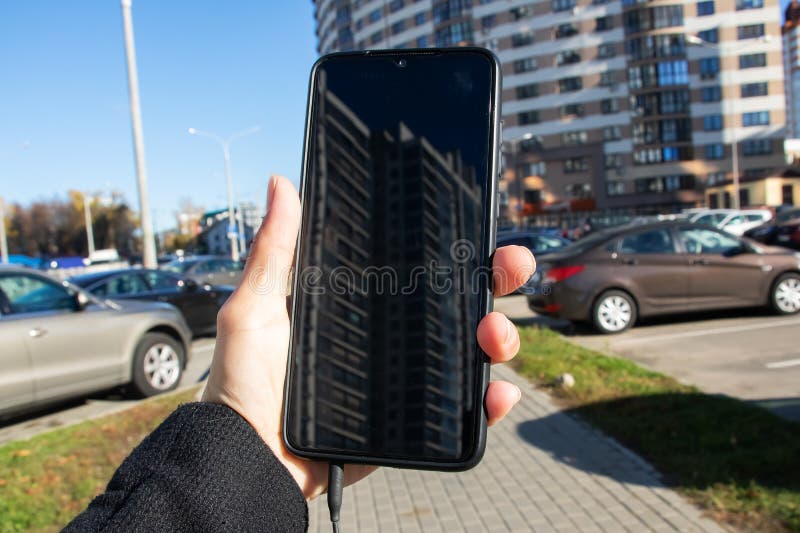 Phone in Your Hand Against Backdrop of Tall Modern Buildings Stock ...