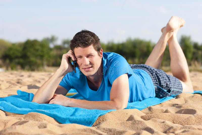 Phonecall on the beach stock photo. Image of roaming - 41941124