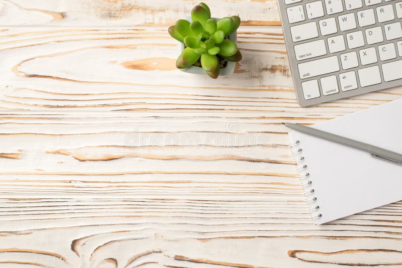 Photo Above of Keyboard Plant Notepad Pen on the Wood Table Stock Photo ...