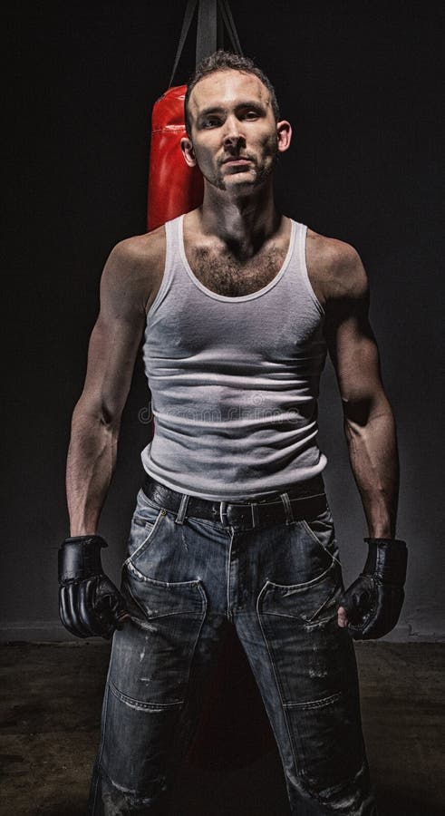 Photo of Aggressive Man and Red Boxing Bag Stock Photo - Image of anger ...