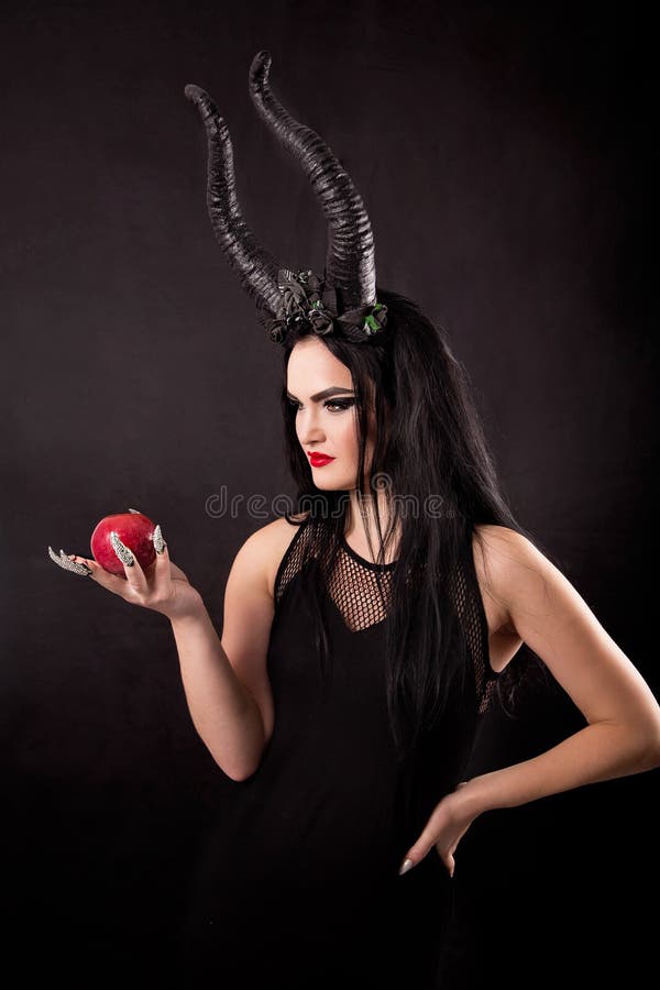 An Apple in the Hands of a Horned Witch Stock Image - Image of ...