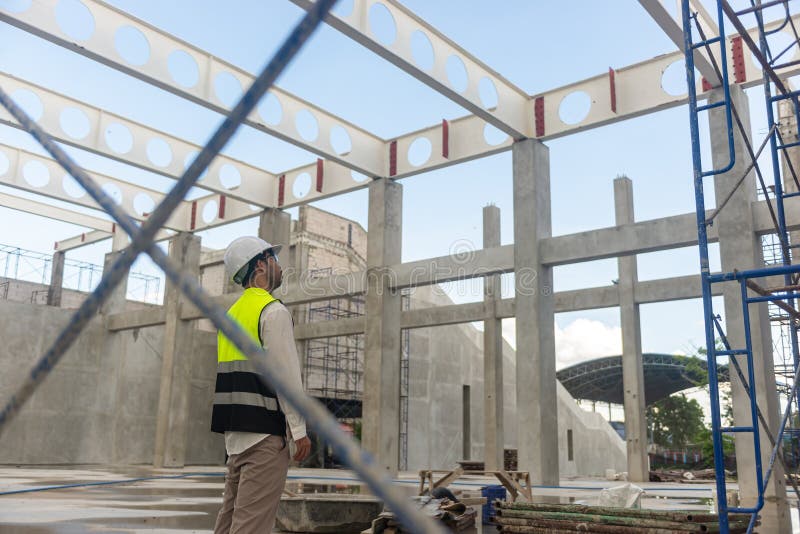 Architect Engineer is Checking the Progress of the Building Project and ...