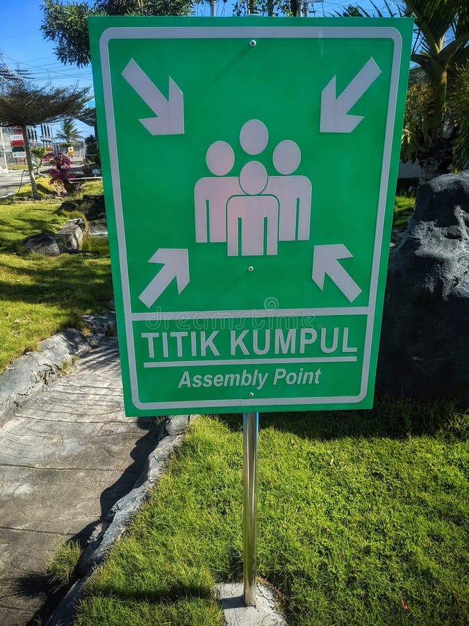 Photo of the Assembly Point Warning Board Here Stock Image - Image of ...