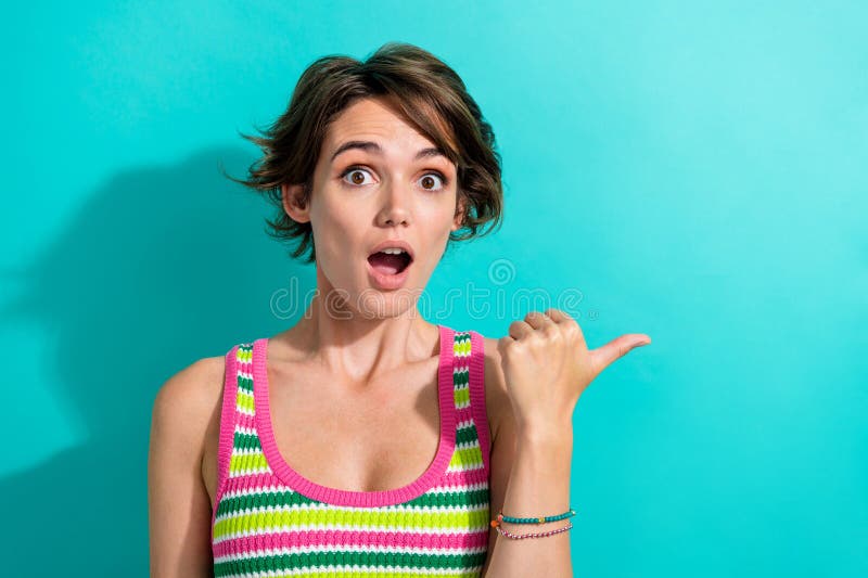 Photo Of Astonished Pretty Girl Open Mouth Indicate Thumb Finger Empty