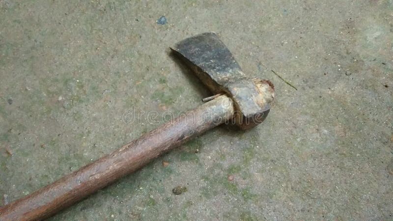 Photo of an Axe on the Ground Stock Image - Image of hand, clothing ...