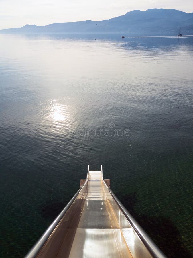 Beach slide into the sea stock photo. Image of modern - 177735750