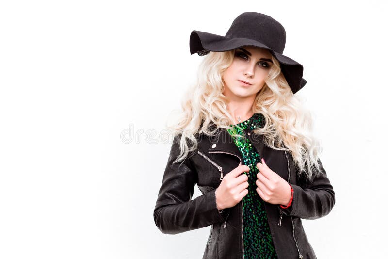 Beautiful Blonde Girl In A Brilliant Dress And Leather Jacket Posing