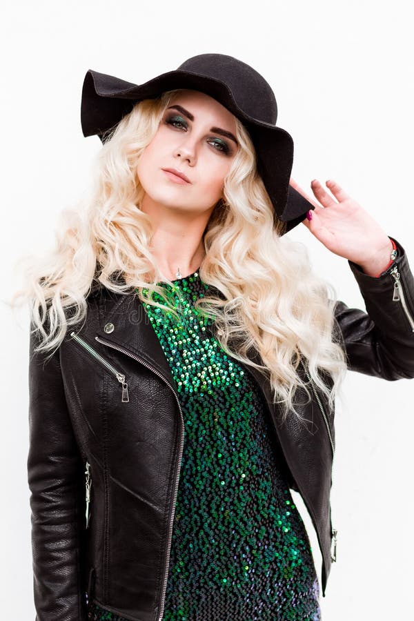 Beautiful Blonde Girl In A Brilliant Dress And Leather Jacket Posing