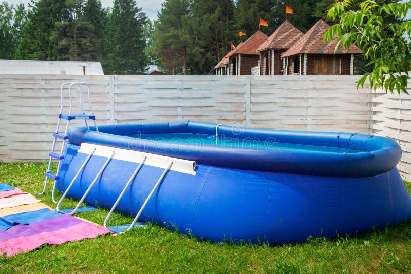 Blue Inflatable Pool among Garden Stock Photo - Image of background ...
