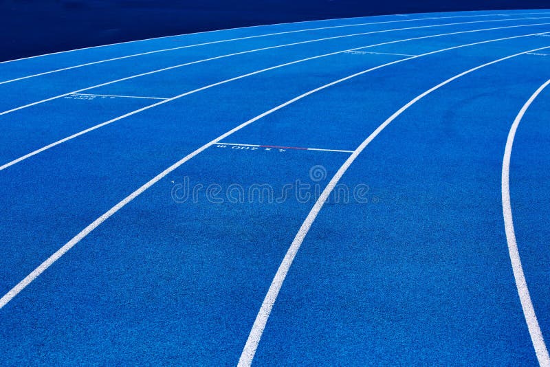 Photo of Blue Tracking Field on Stadium Stock Photo - Image of seats ...
