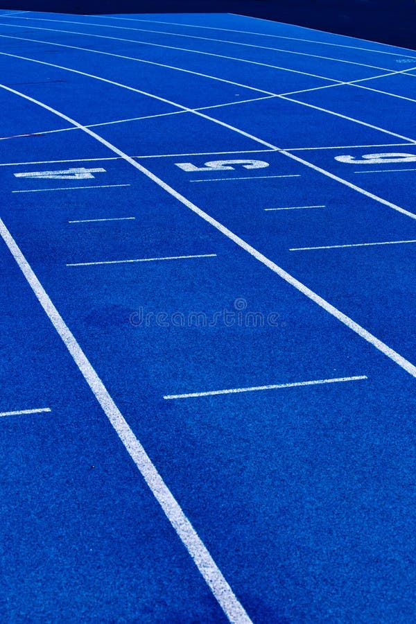 Photo of Blue Tracking Field on Stadium Stock Image - Image of chair ...