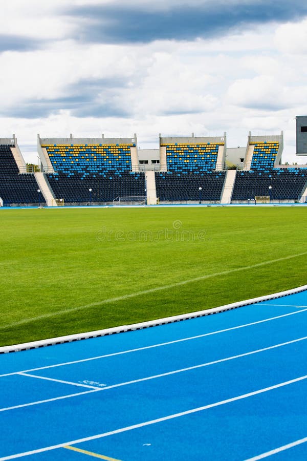 Photo of Blue Tracking Field on Stadium Stock Image - Image of empty ...