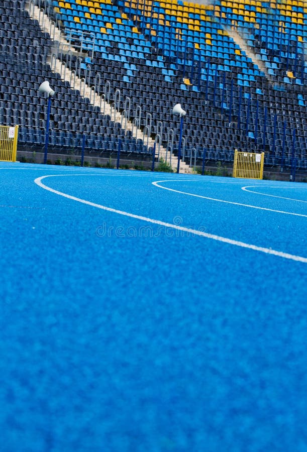 Photo of Blue Tracking Field on Stadium Stock Image - Image of chair ...