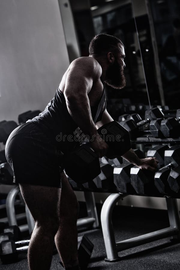 Poto Bodybuilder Working Out in a Gym Stock Image - Image of club ...