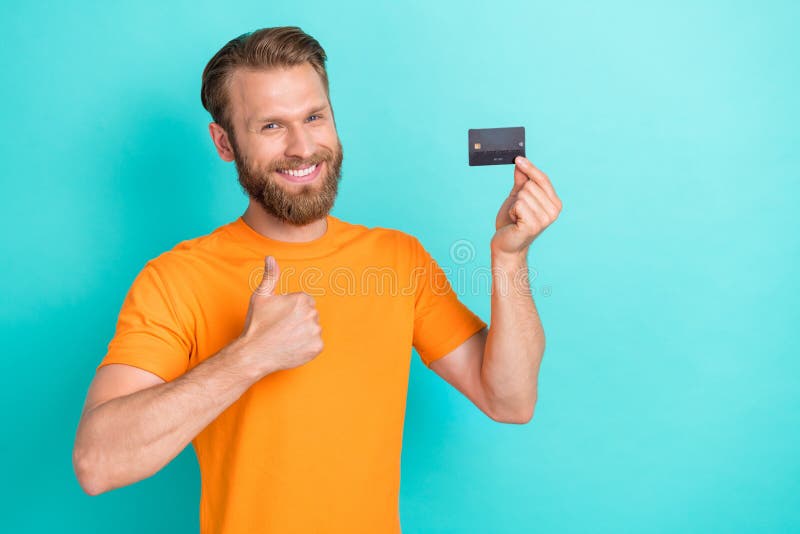 Photo Of Boss Beard Guy Hold Card Thumb Up Wear Orange T Shirt Isolated