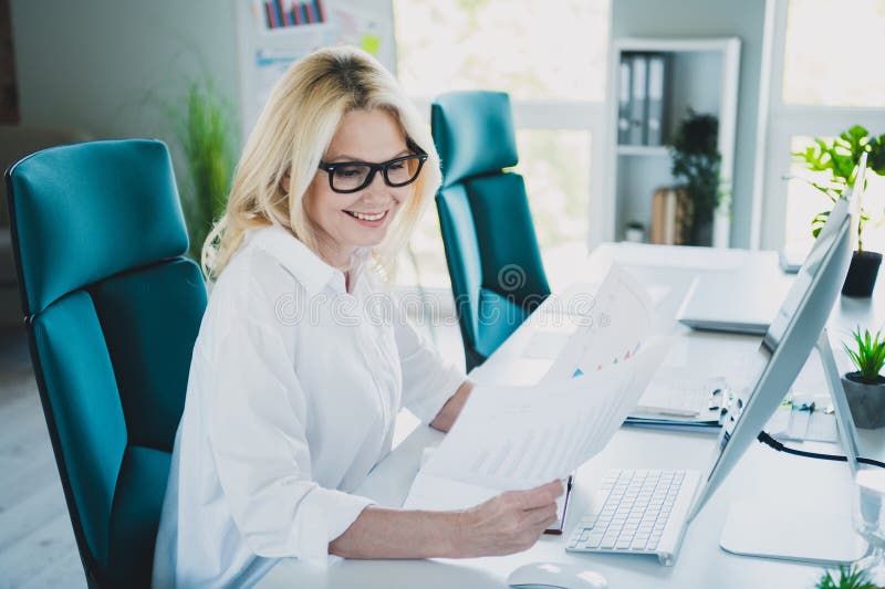 Photo of Broker Lady Working with Documents Holding Paper Data Diagrams ...