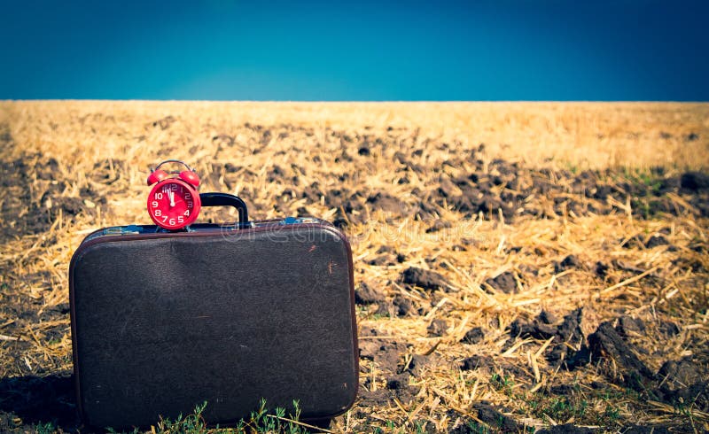 Suitcase and alarm clock stock image. Image of clouds - 129762541