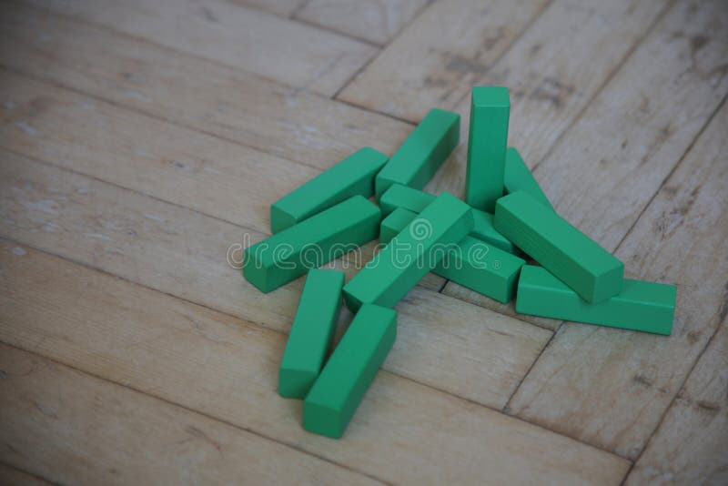 Bunch of Green Wooden Blocks on a Wooden Floor Stock Photo - Image of ...