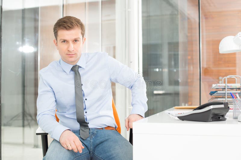 Businessman Sitting at Office Desk Stock Photo - Image of poland ...