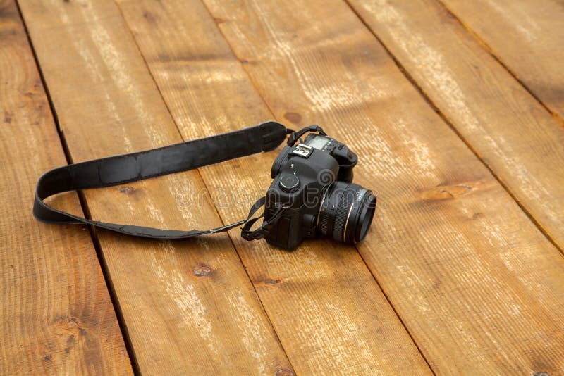 Photo camera on the floor stock photo. Image of camera - 75929342