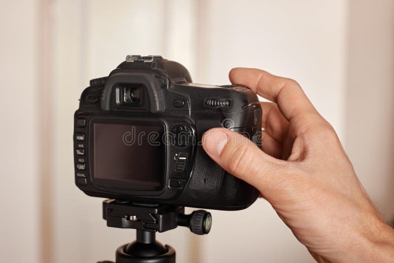 Photo camera with hand stock image. Image of artist - 107933213