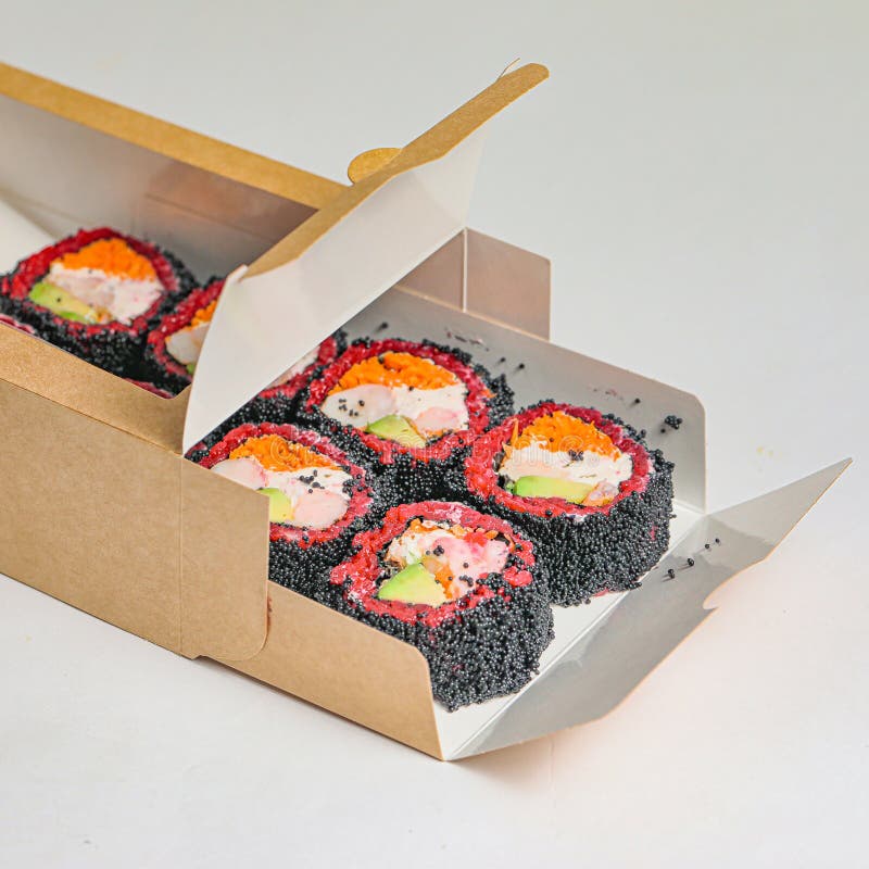 A Box Filled with Various Sushi on Table Stock Photo - Image of sashimi ...