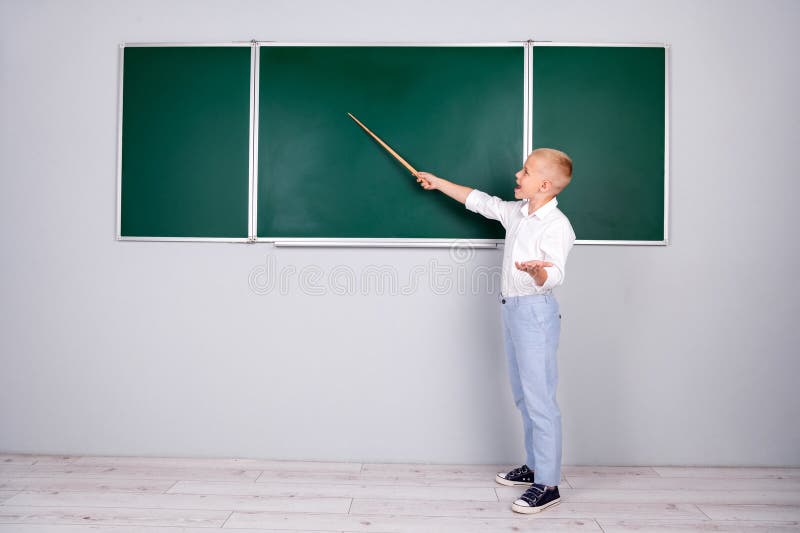Photo of Charming Clever Nice Boy Learner Standing in Class Room ...