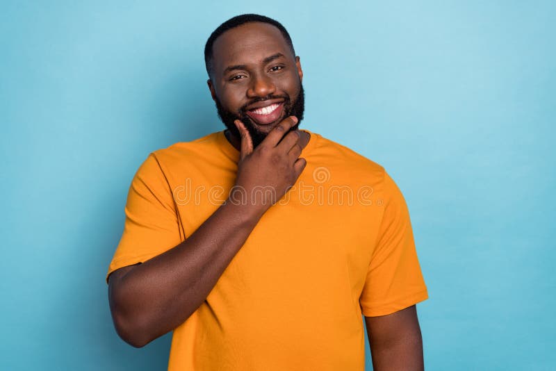 Photo Of Cheerful Cute Guy Wear Orange T Shirt Arms Chin Smiling