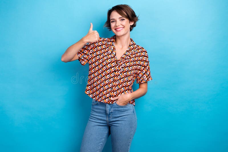 Photo Of Cheerful Nice Girl Toothy Smile Demonstrate Thumb Up Isolated