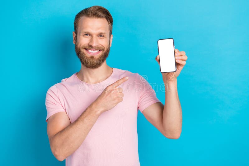 Photo Of Cheerful Positive Guy Dressed Pink T Shirt Pointing Finger