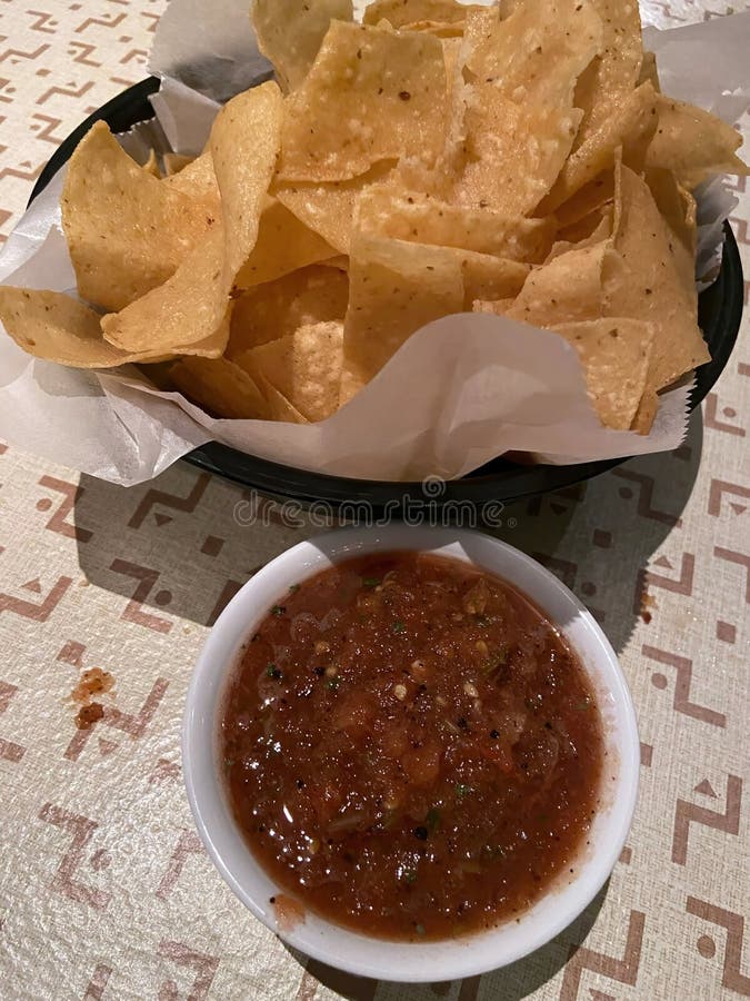 Chips with Red Salsa at a Mexican Restaurant Stock Photo - Image of ...