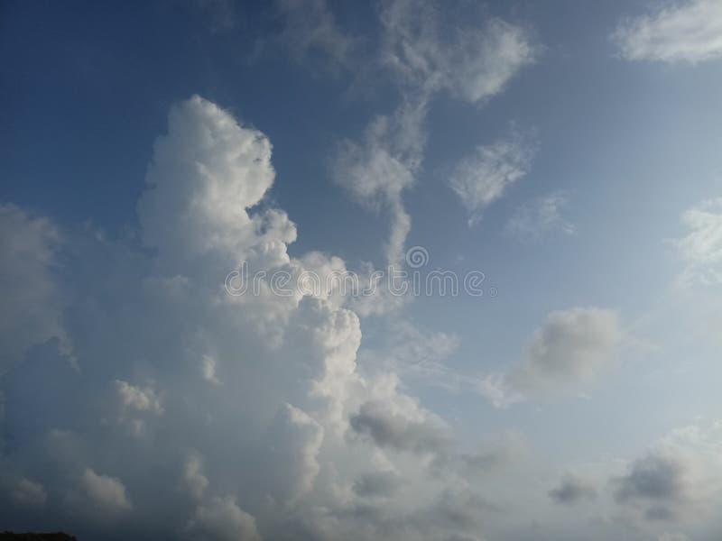 Photo of a Clear Daytime Sky with Large Cumulus Clouds Dominating the ...