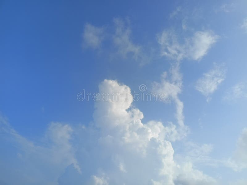 Photo of a Clear Daytime Sky with Large Cumulus Clouds Dominating the ...