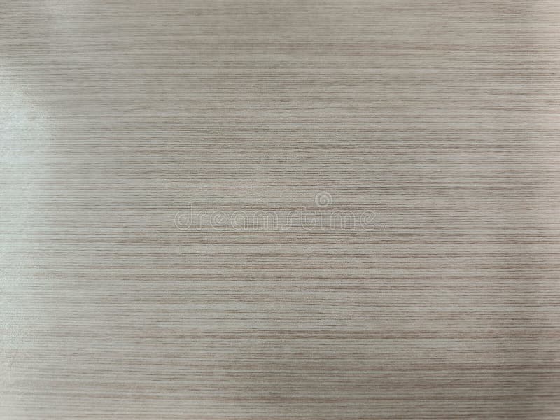 The Photo is a Close-up Shot of a Light Beige Surface with a Subtle ...