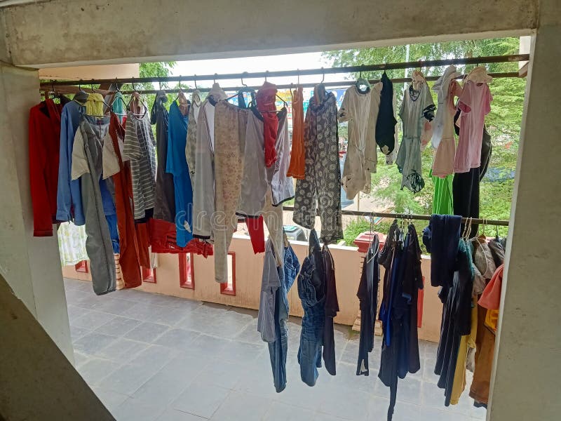 Photo of Clothes Drying in Front of the House, Drying Clothes Using ...