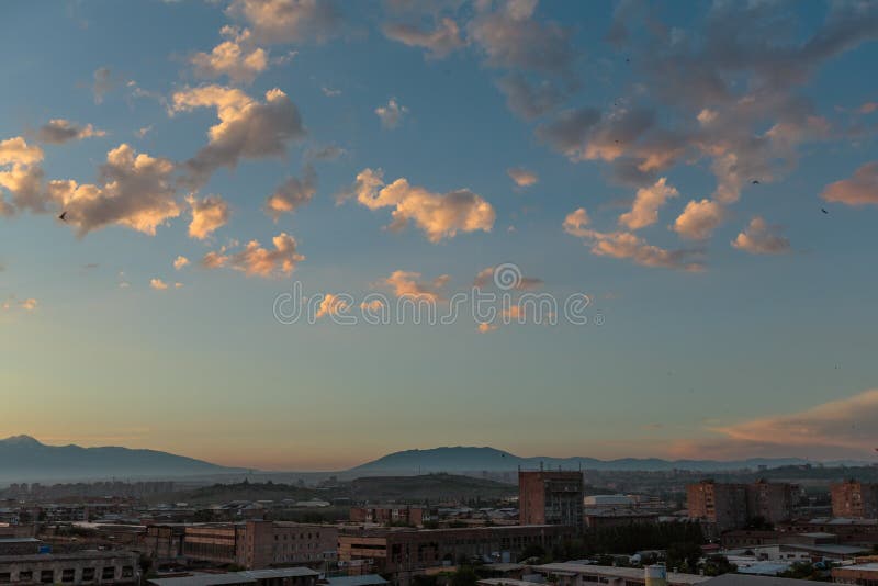 Photo of Clouds and Infrastructure of a Small Town Stock Photo - Image ...