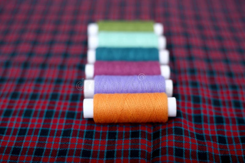 Photo of Colored Sewing Thread on the Cloth Stock Image - Image of ...
