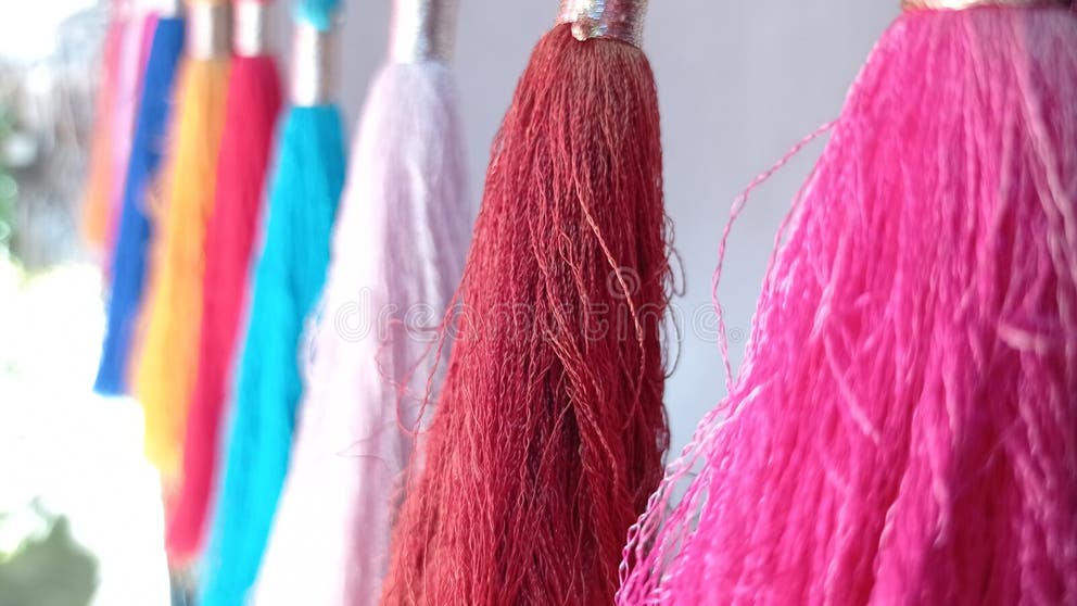 Photo of Colorful Thread Hanging Stock Photo - Image of hair, purple ...