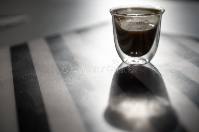 Photo of Cup with Black Coffee and Shadow on Black and White Background ...