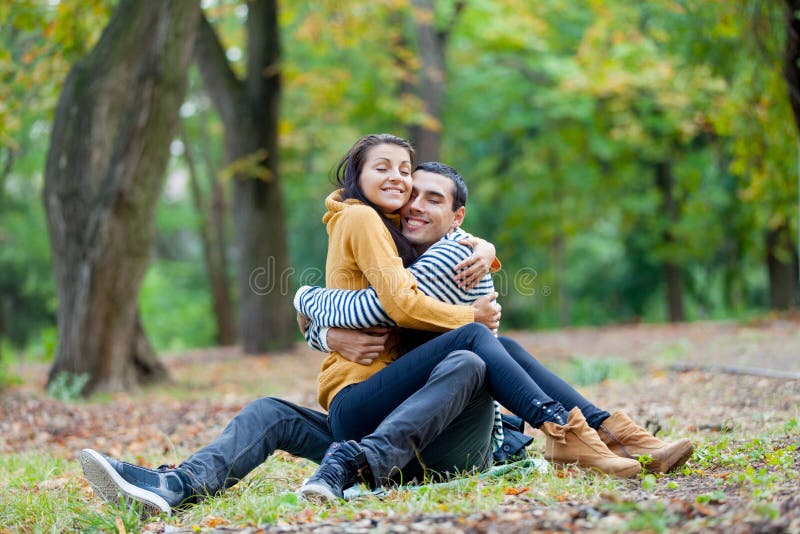 Photo of Cute Couple Hugging on the Ground on the Wonderful Autu Stock ...