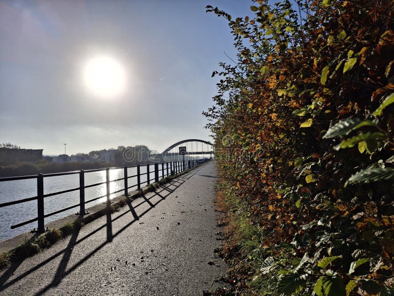 A Photo of a Cycle Path Walking Path Along the Canal. Stock Photo ...