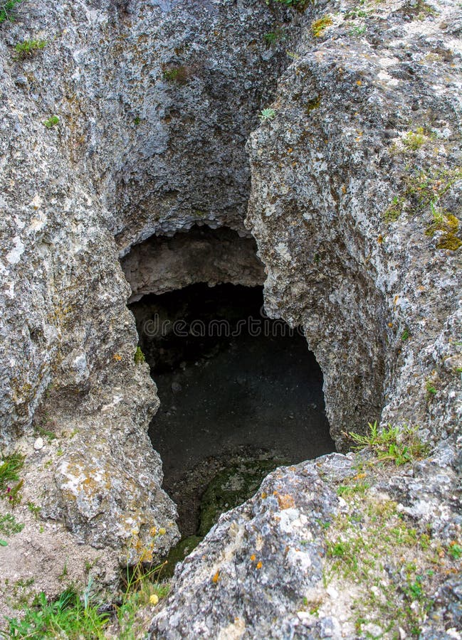 Photo of Dark Cave Hole in the Rock Stock Photo - Image of earth ...