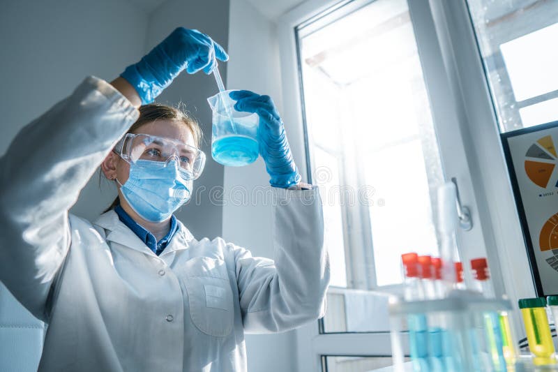 The Photo Depicts a Scientist Testing on Instruments in a Chemical ...