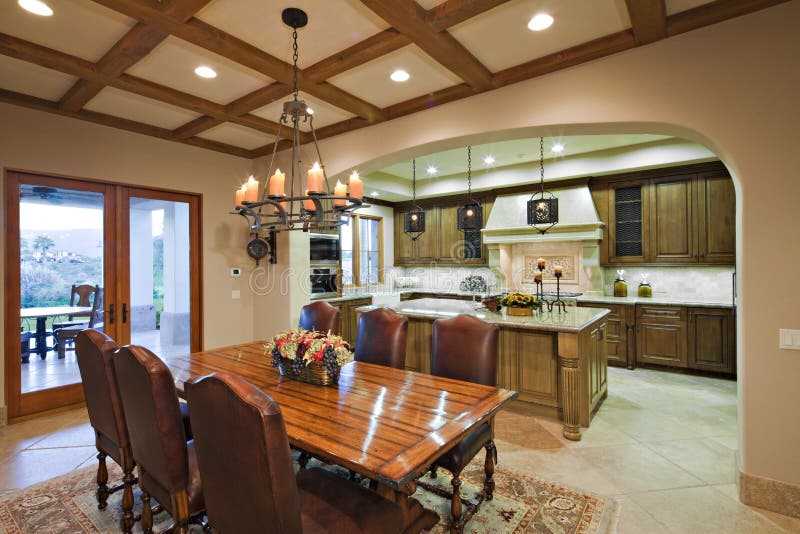 Dining Table Near Kitchen in Luxury Mansion Stock Image - Image of ...