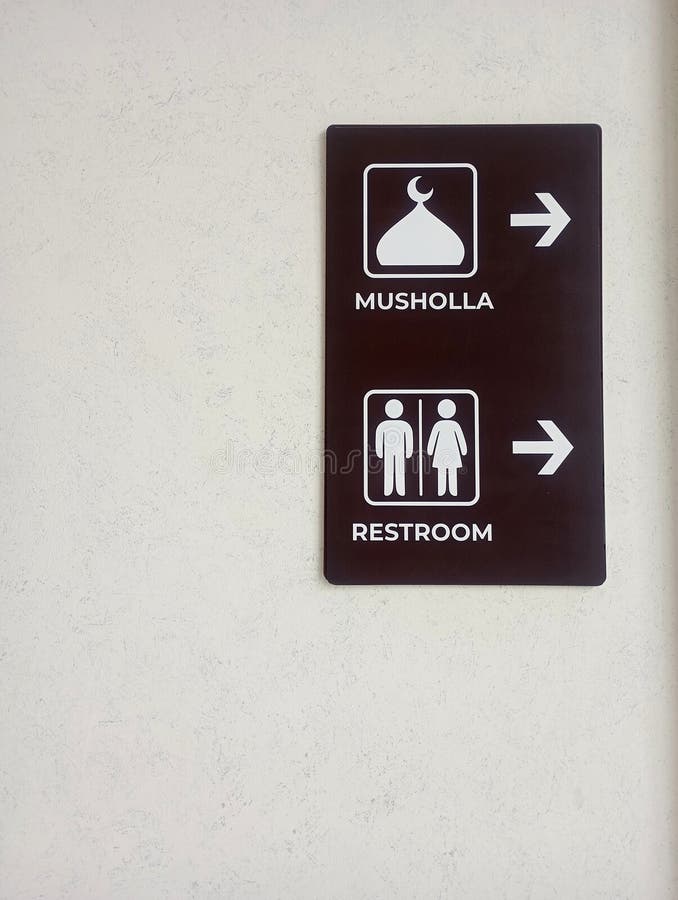 Photo of Directional Signs for the Prayer Room and Restroom Stock Image ...
