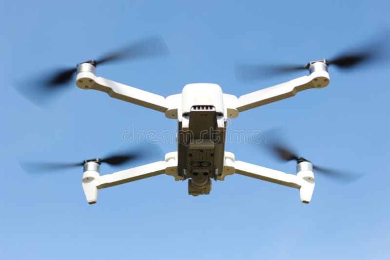 A Photo of a Drone Flying with a Blurry Propeller Stock Photo - Image ...