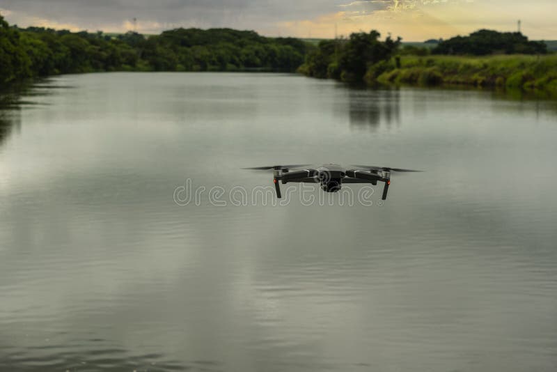 Photo of a Drone Flying Over the Tiete River in a Cloudy Day Stock ...