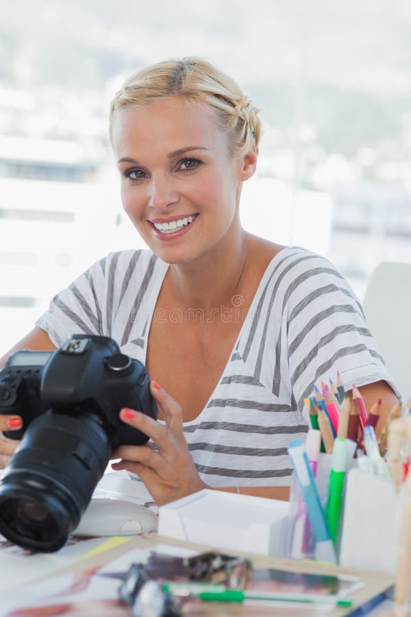 Photo Editor Looking at Her Digital Camera Stock Image - Image of ...