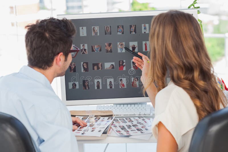Photo Editors Choosing Thumbnails Stock Photo - Image of desk ...
